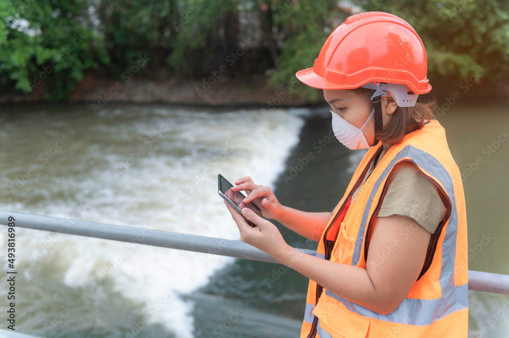 Asian Female engineering working . at sewage treatment plant,Marine ...