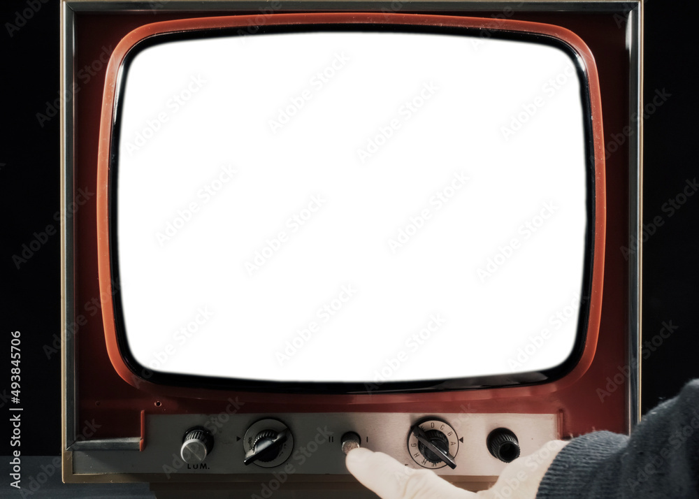 The hand of a man turning on and off a retro vintage tv set, with a ...