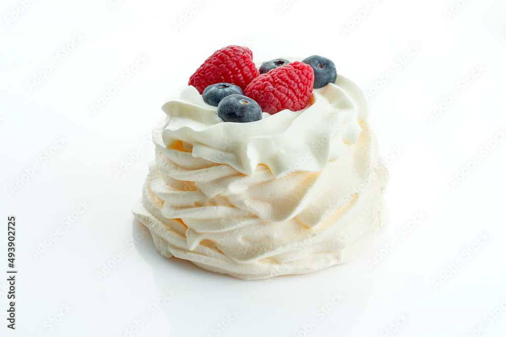 Pavlova cake with berries on white background Stock Photo | Adobe Stock
