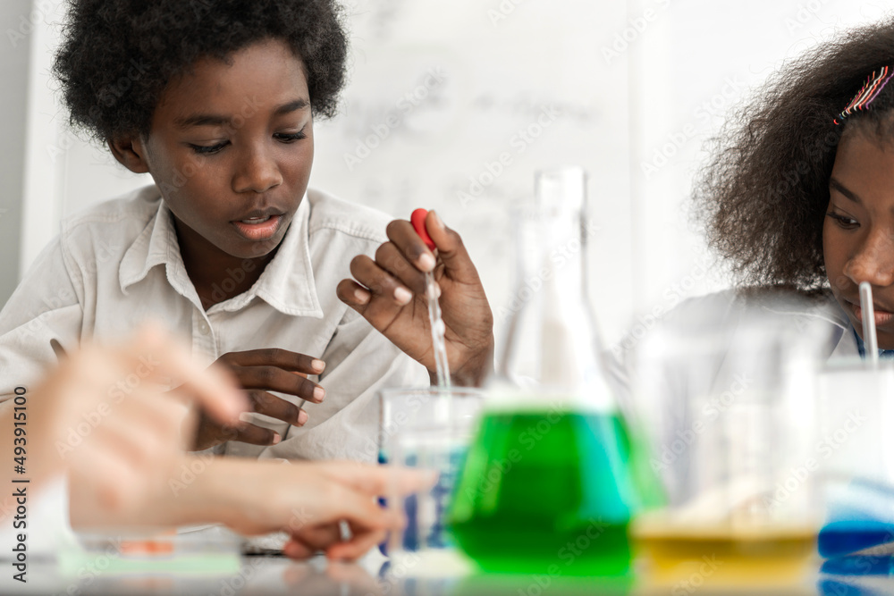 Two african american cute little boy and girl student child learn ...