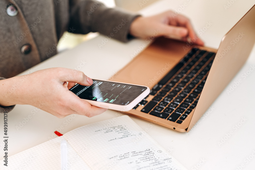 Stock market investor hands holding a phone investment app index growth ...