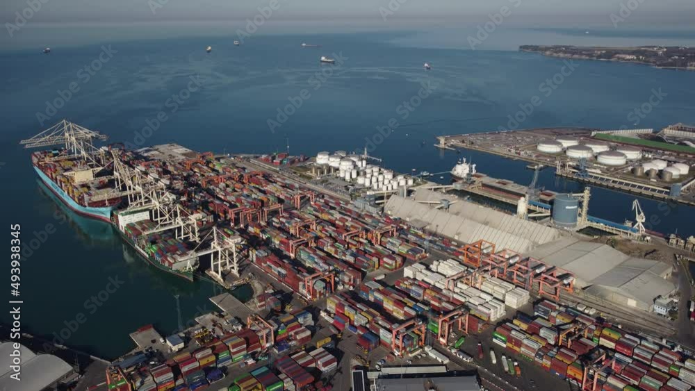 Container ship loading and unloading in deep sea port, Aerial view of ...
