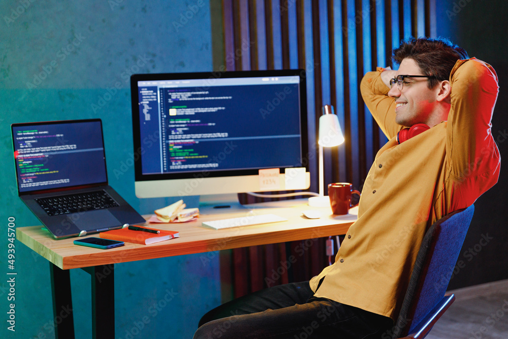 Side view happy satisfied young software engineer IT specialist ...