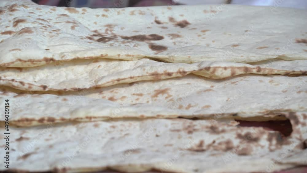 Lavash is a thin flatbread traditionally baked in a tandoor (tonir ...
