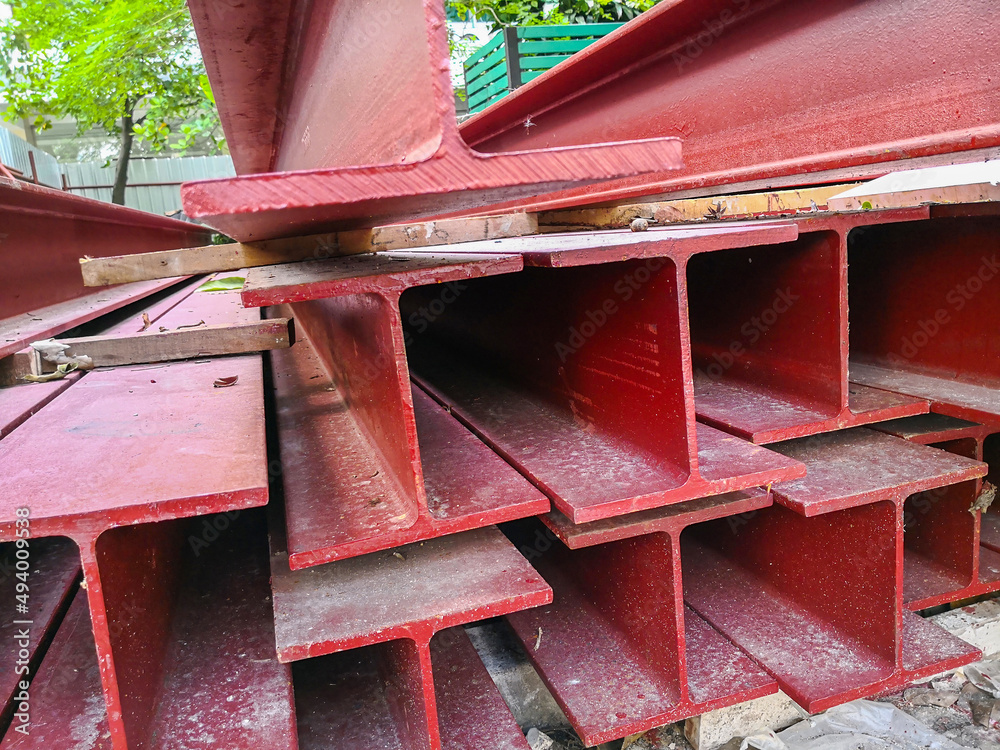 Pile of steel beam paint red color preparing for structure construction ...