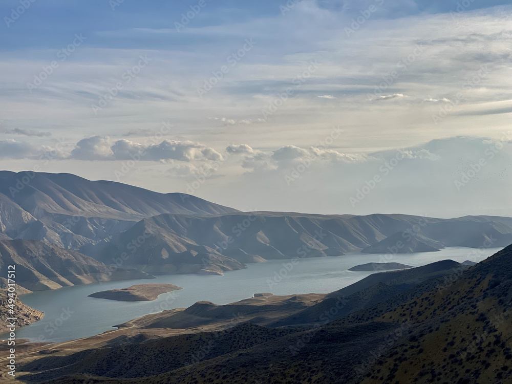 Picturesque reservoir with blue water in an arid area. The Azat River ...