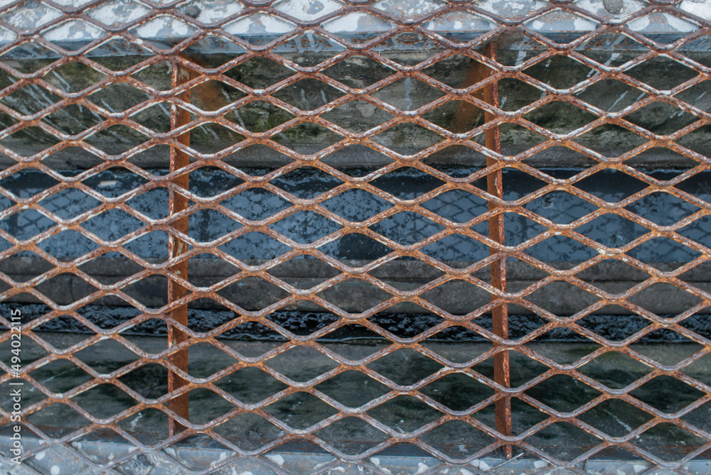 A metal grid background was used to create a high-altitude walking ...