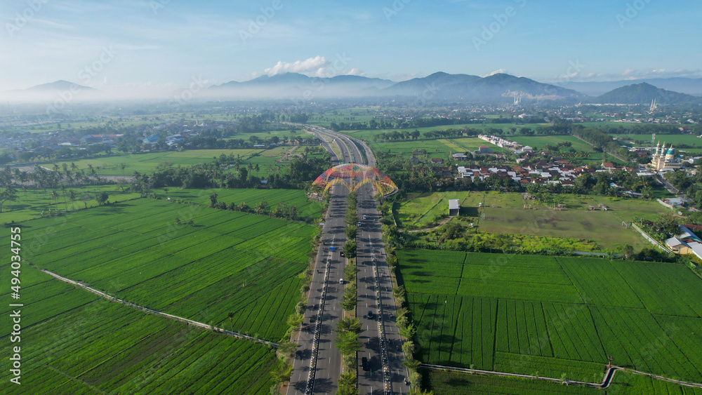 Aerial view of the city colorful Monument Tembolak Rainbow on Mataram ...