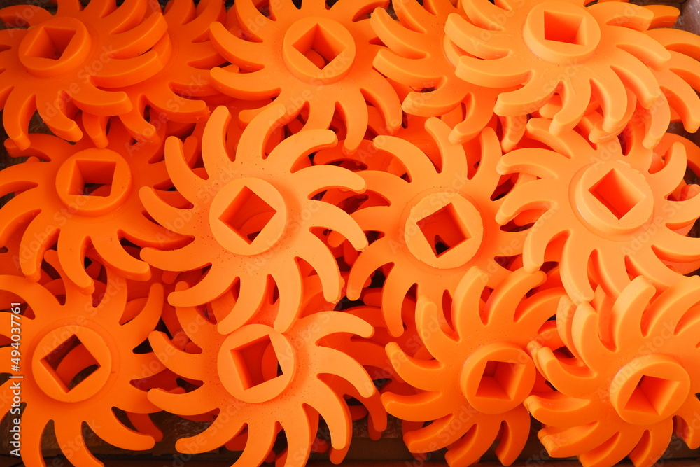 Orange elements of the disk separator of bulk products.Plastic orange ...