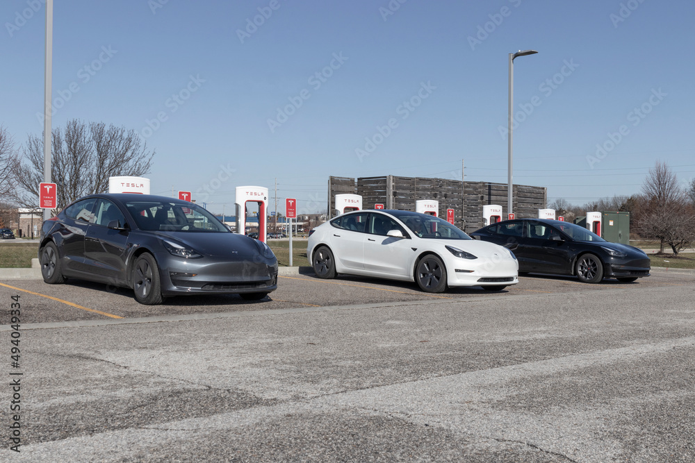 Tesla EV electric vehicles charging. Tesla products include electric ...