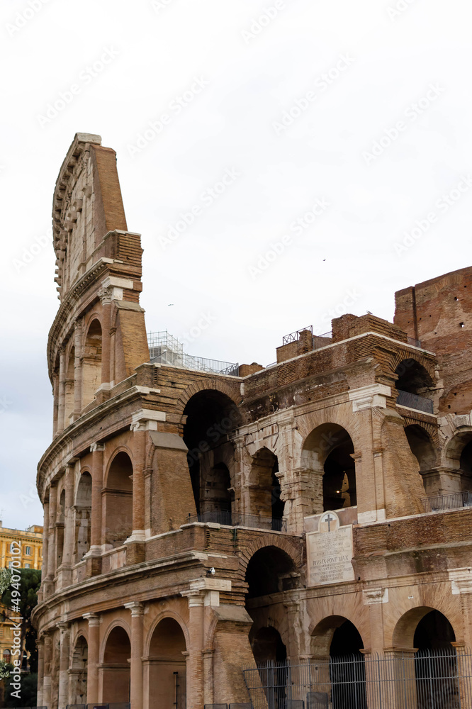 Vertical closeup of the Colosseum - one of the seven wonders of the ...