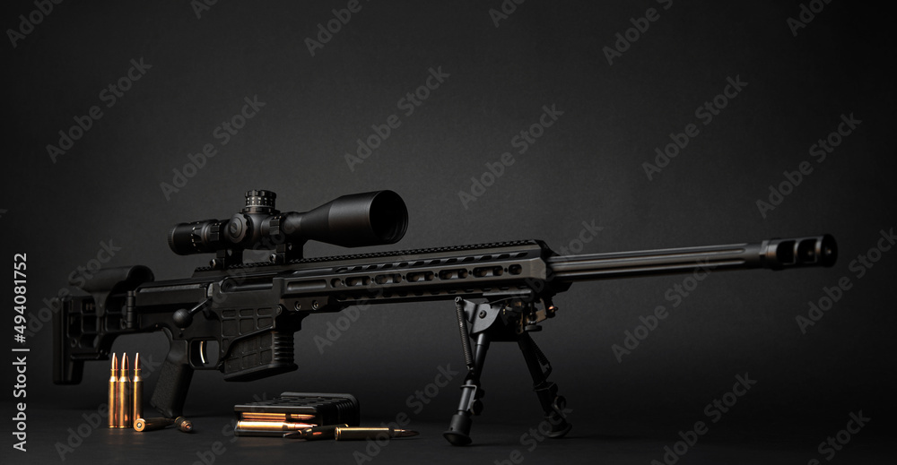 Modern powerful sniper rifle with a telescopic sight mounted on a bipod ...