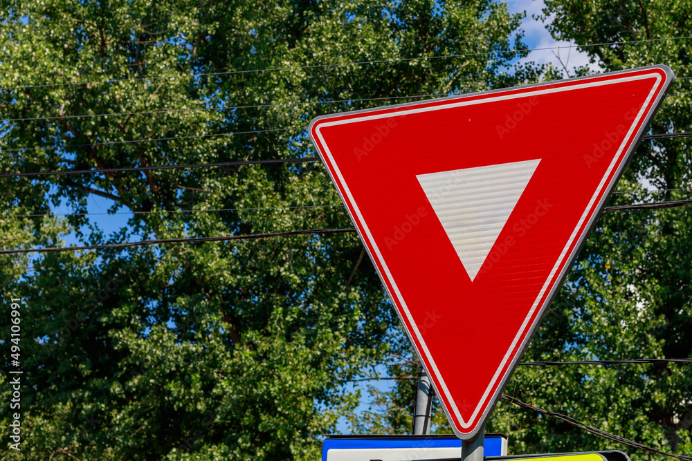 Road warning sign red inverted triangle. Background with copy space ...