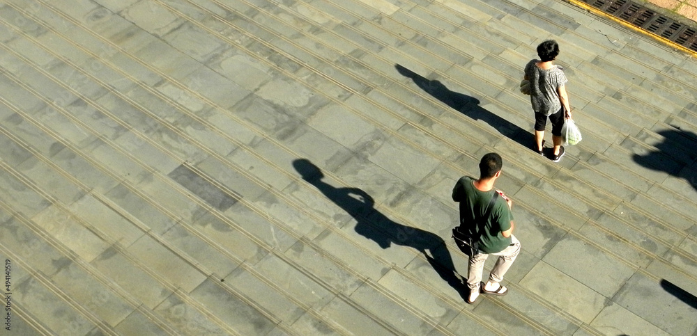 Crowd of people descending stairs in outdoor public building. asian ...