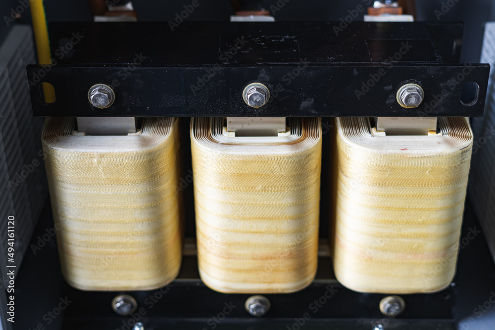 Transformer coils in the electrical control cabinet Stock Photo | Adobe ...