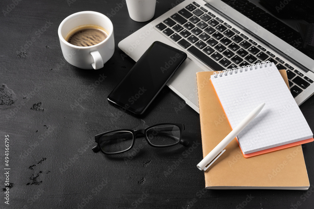Notepad is on top of office desk table with laptop and supplies Stock ...