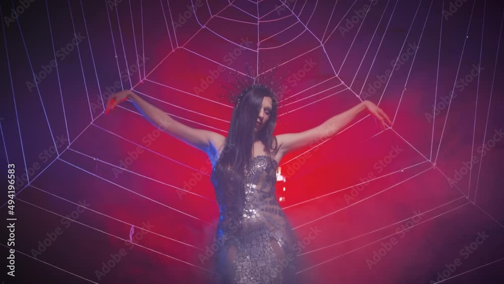 silhouette woman dancer moves seductively, fantasy dance. Lady Spider ...