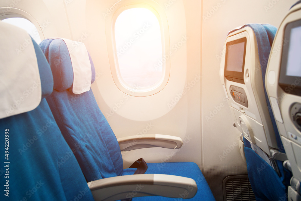 Empty seat and window inside an aircraft Stock Photo | Adobe Stock