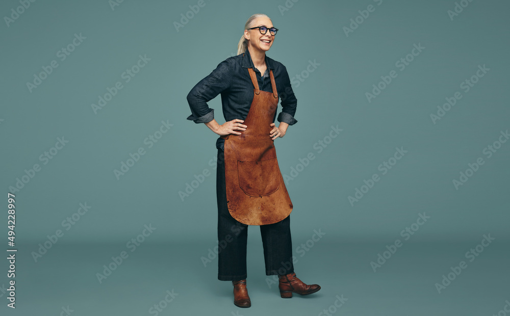 Happy female goldsmith smiling in a studio Stock Photo | Adobe Stock