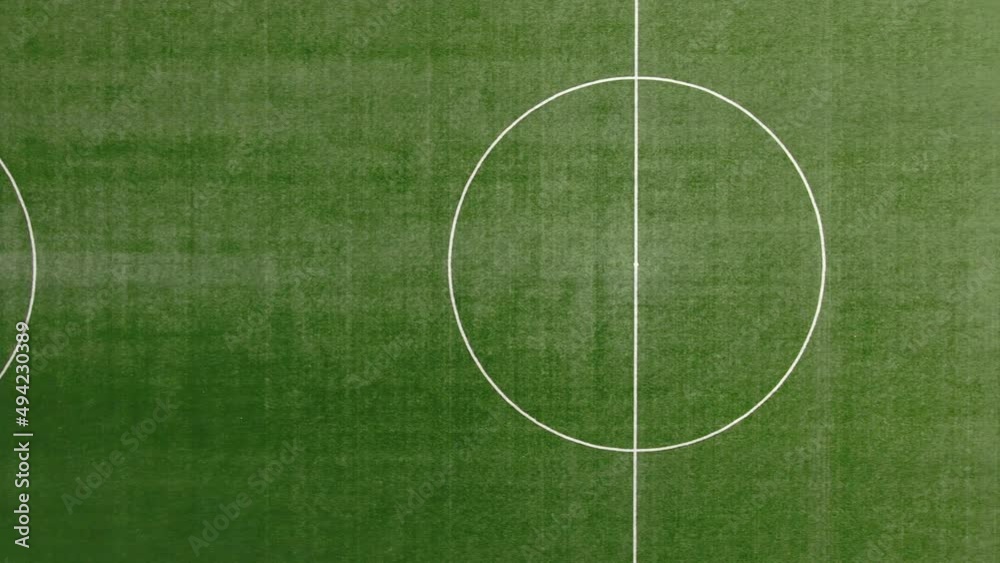 Top view of football or soccer field with green grass and borders lines ...