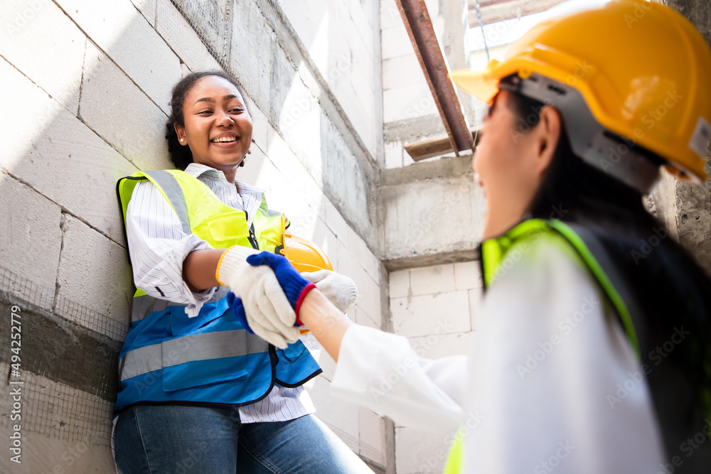 Foto de Engineering woman team joins hands or handshake with the ...