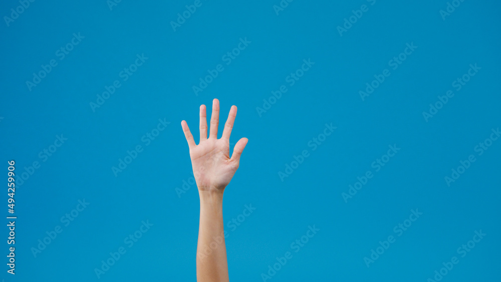 Young woman waving saying greeting, goodbye making hand gestures ...
