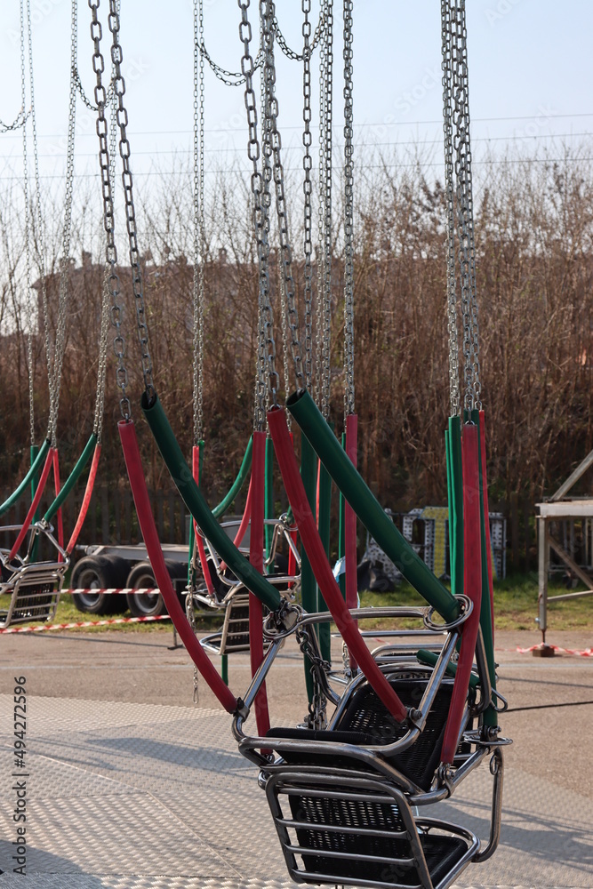 amusement park carousel with funfair seats- Stock Photo | Adobe Stock