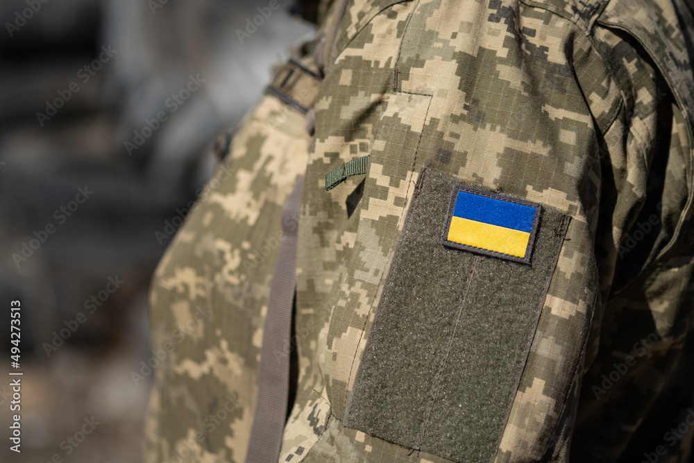 Ukrainian flag on a military uniform, war. Soldier Armed Forces of ...