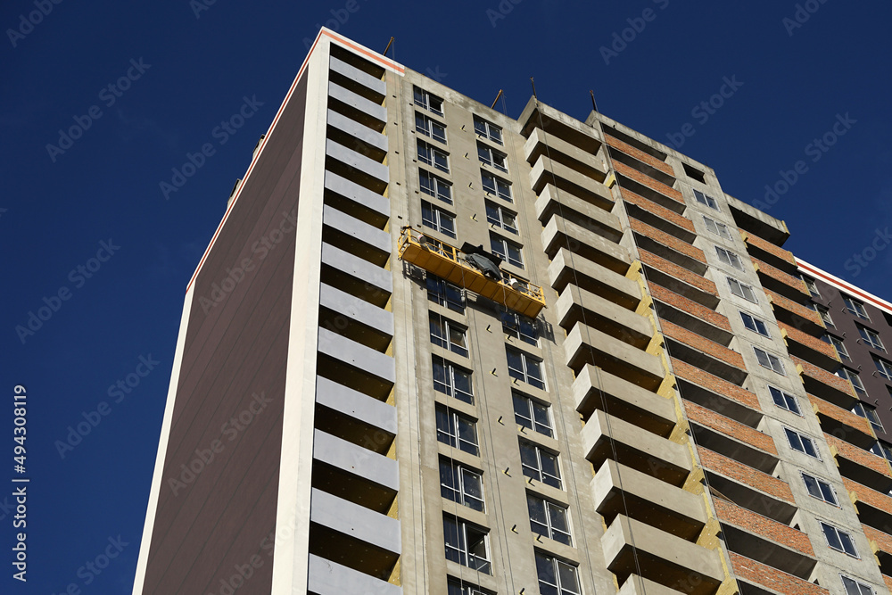 Detail of large concrete residential building with flats and apartments ...