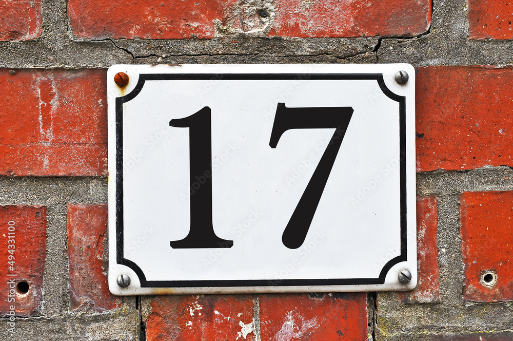 White house number plaque, showing the number seventeen Stock Photo ...