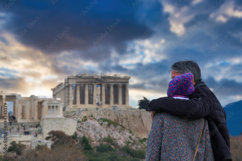 couple in love looks embracing the Acropolis of Athens, Greece Stock ...