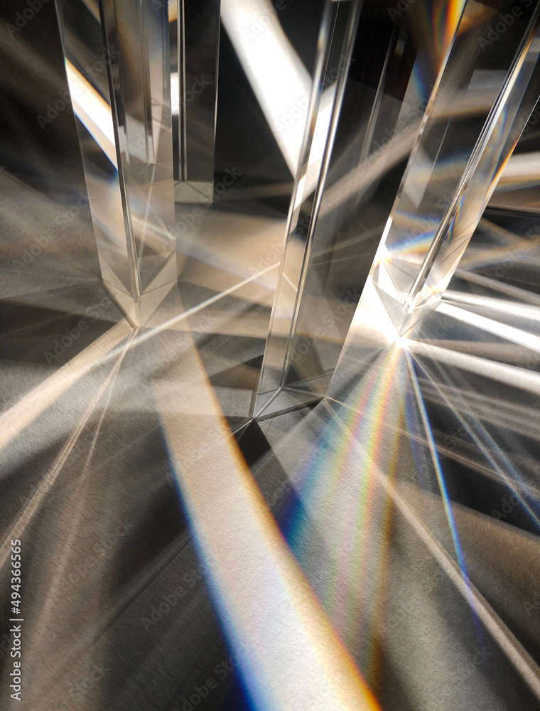 Close up image of group of crystal clear triangular glass prisms ...