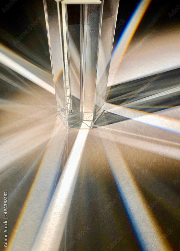 Close up image of group of crystal clear triangular glass prisms ...