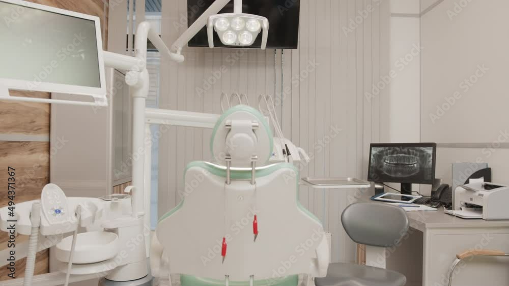No people slowmo of modern dental office interior with chair, equipment ...