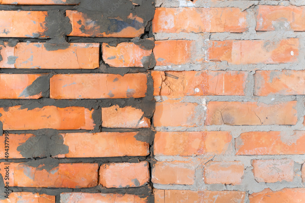 Old and fresh brickwork on the same wall. Fresh uncured wet concrete ...
