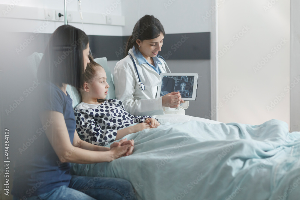 Pediatric hospital radiology specialist talking about x-ray scan ...