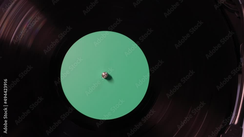 Vinyl retro record on DJ turntable record player. Black vinyl ...