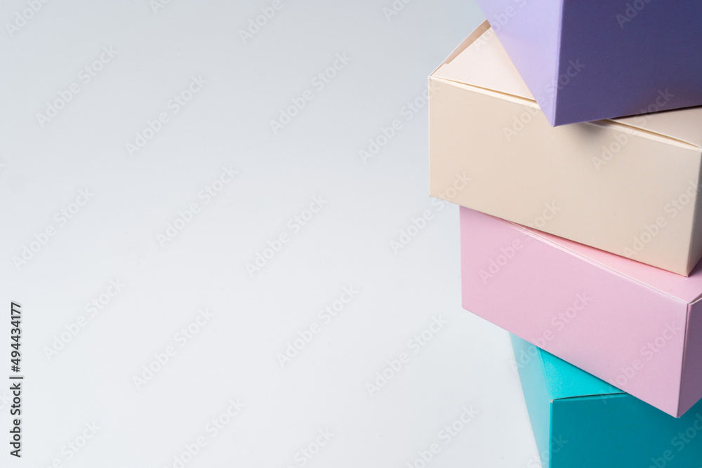 Pile of colorful cardboard boxes on white background Stock Photo ...