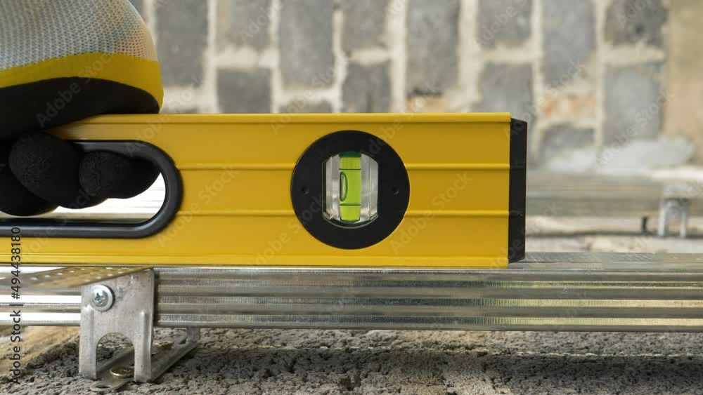 Balance ruler. Measurement of the horizontal level of the metal profile ...