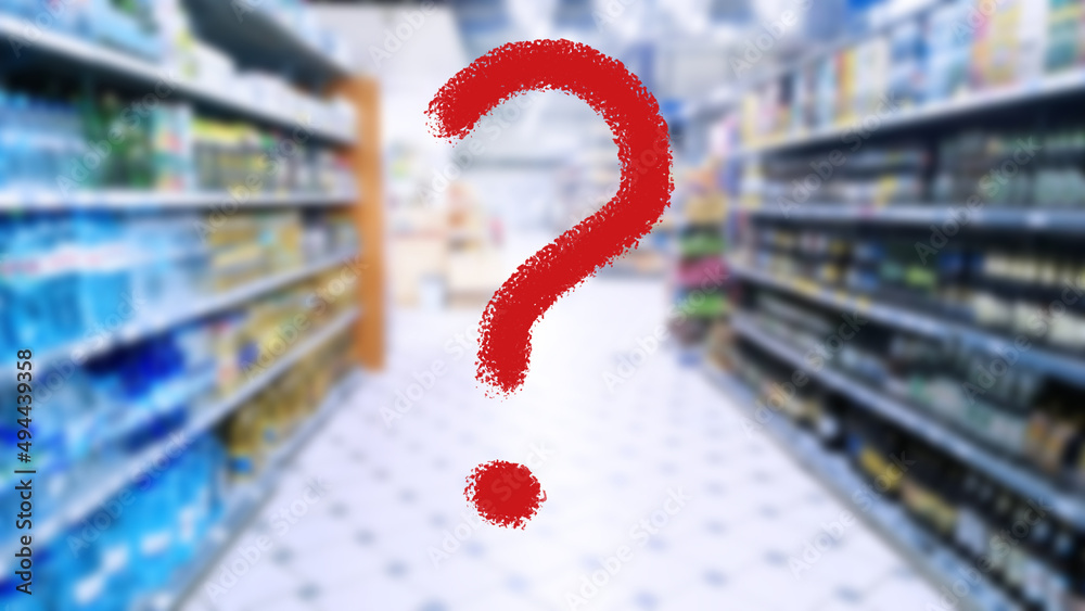Large red question mark on blur supermarket background. Defocused ...