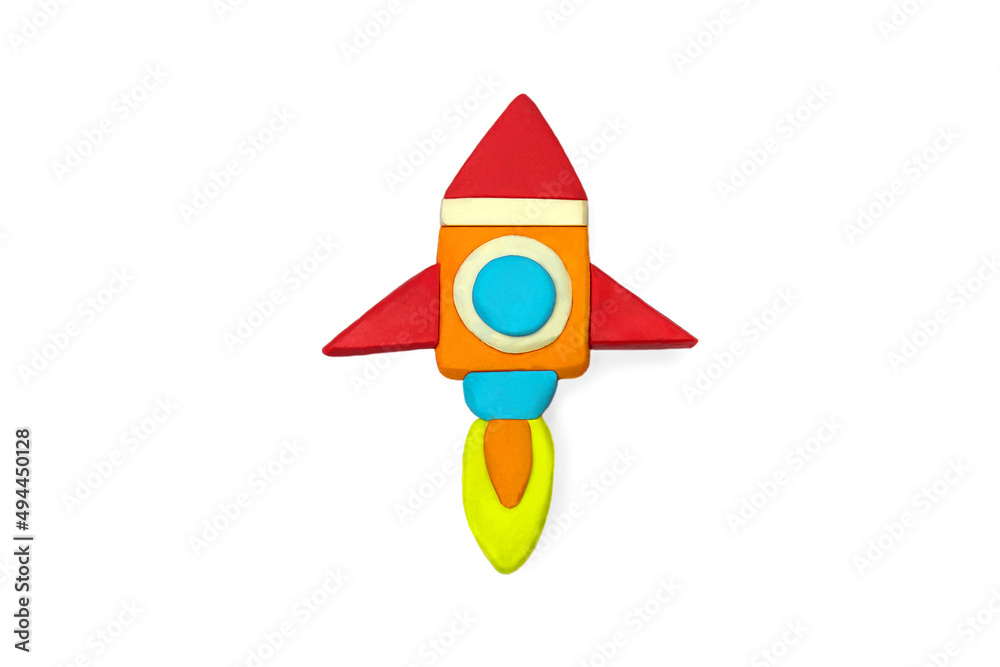 Space rocket molded from multi-colored plasticine on a white background ...