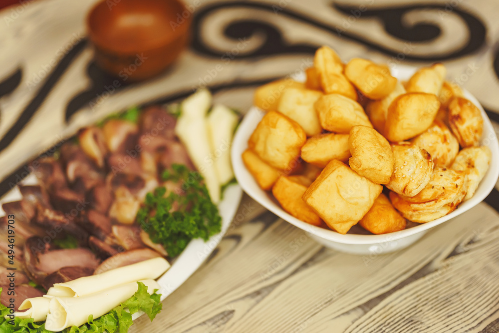 Baursak is a national Kazakh bread product on the table. Central Asian ...