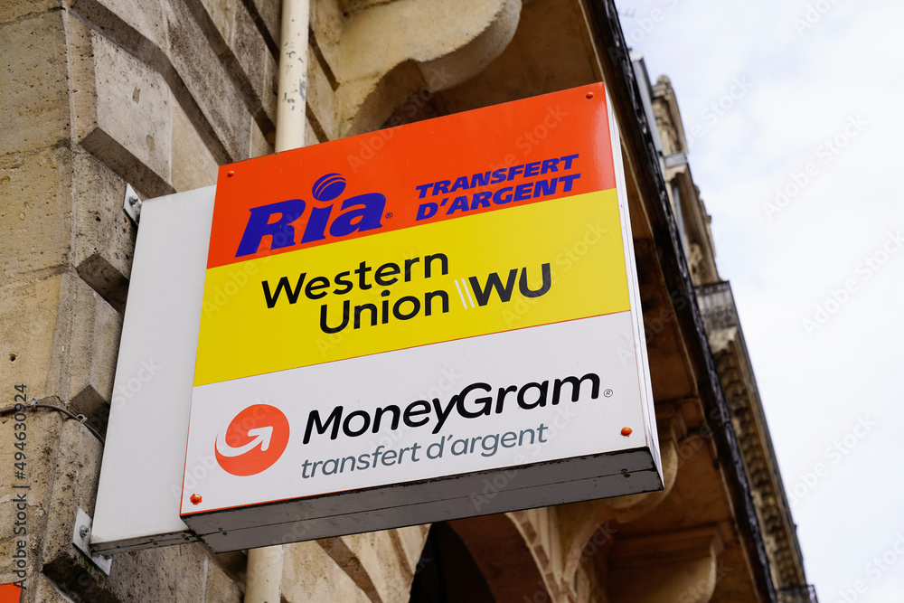 MoneyGram western union and ria money transfer sign text and brand logo ...