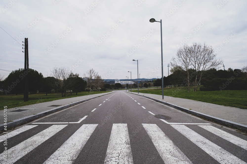 empty street with traffic signs in an industrial area in a Spanish city ...