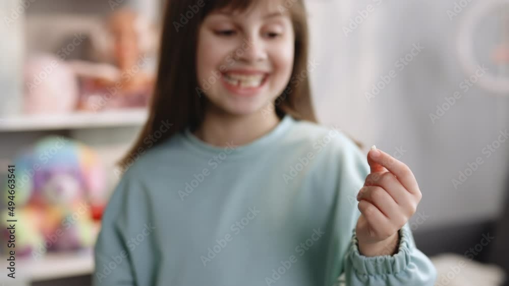 Happy Cute little girl with tooth first milk temporary tooth. Children ...