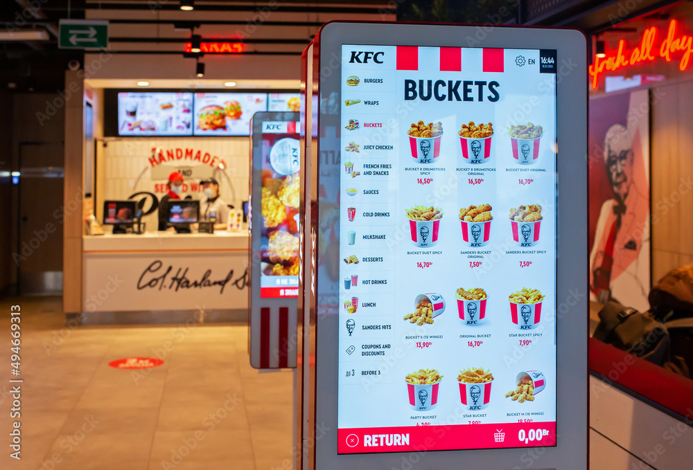 Self order kiosk machines installed inside of a KFC fast food ...