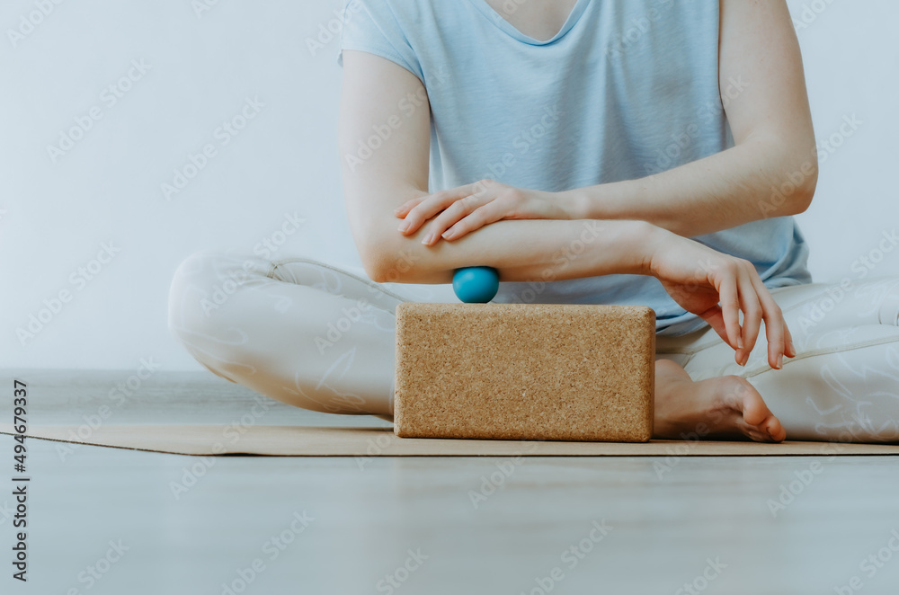 Forearm muscles myofascial release with small therapy ball on cork ...