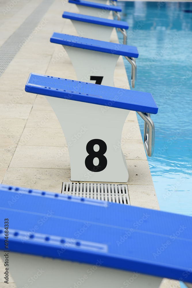 starting place in the pool, outdoor swimming competition. swimmers ...