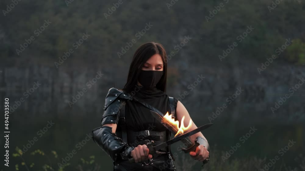 Portrait fantasy woman warrior assassin holding two burning blade ...