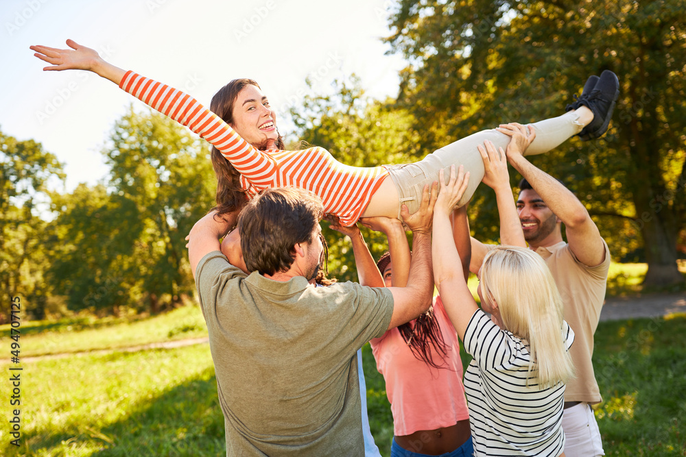 Young people pick up a woman together Stock Photo | Adobe Stock